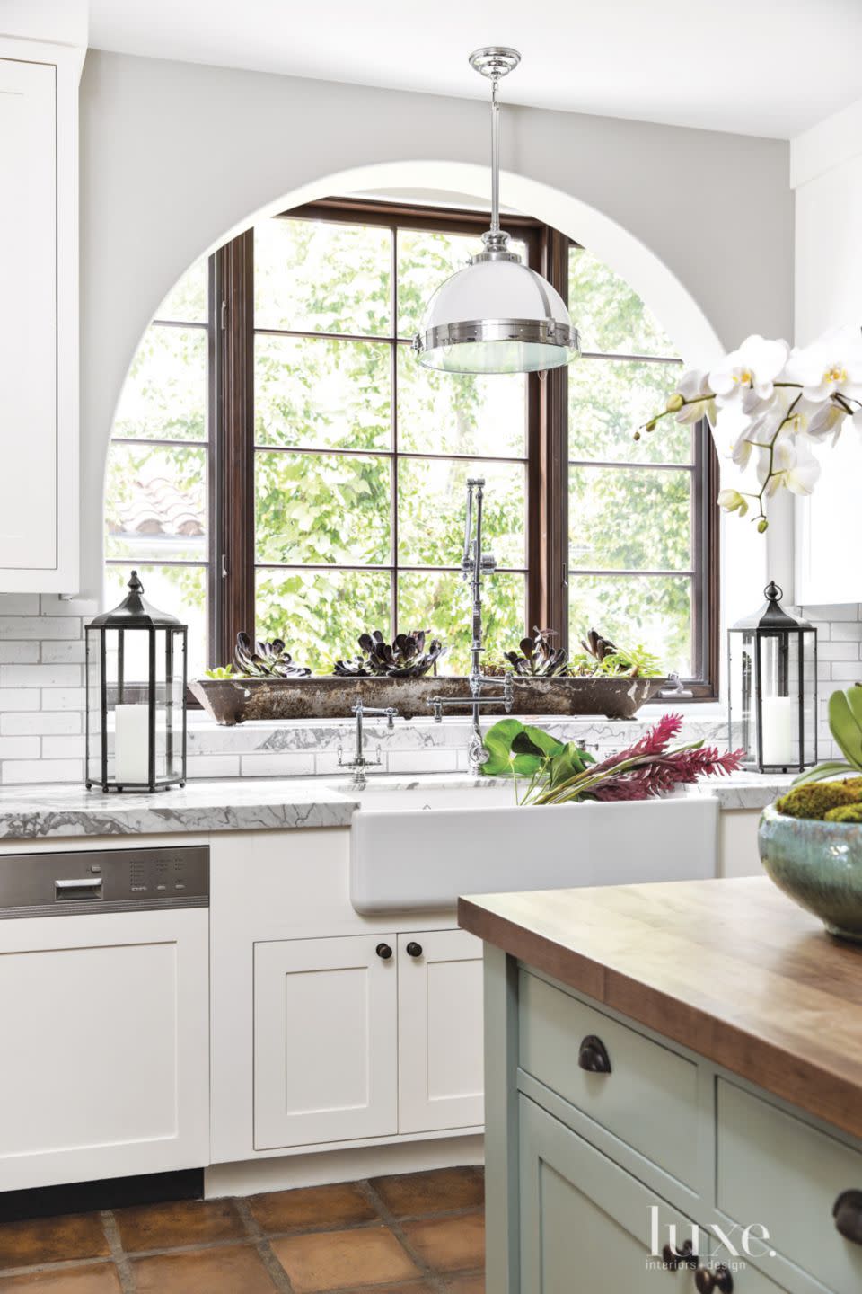 Spanish Colonial White Kitchen with Archways | LUXE Interiors + Design