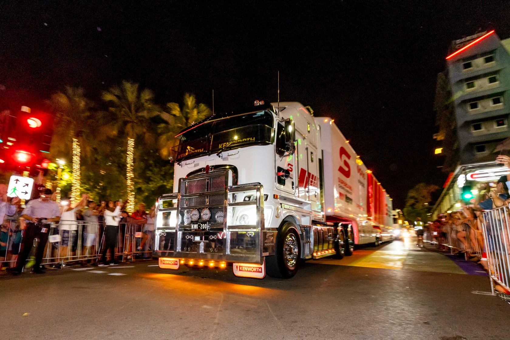 Gallery: Transporter convoy lights up Darwin CBD | Supercars
